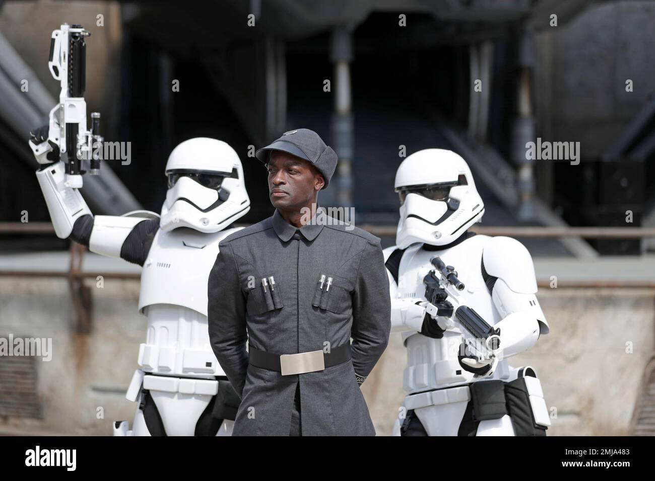 A First Order officer, center, and two storm troopers on patrol during ...