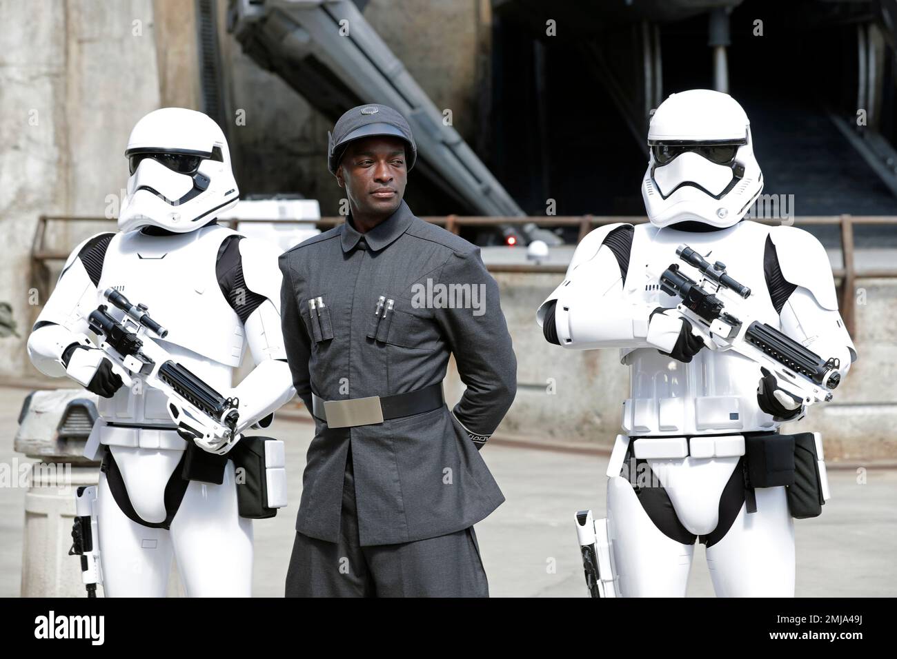 A First Order officer, center, and two storm troopers on patrol during ...
