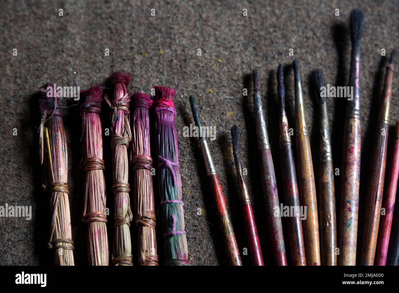In this July 31, 2019, photo, handmade traditional brushes, left, are ...
