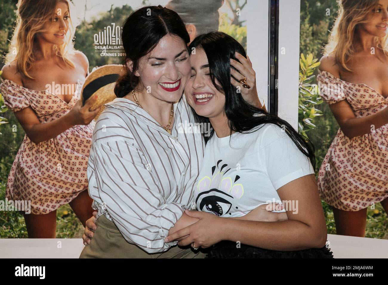 French director Rebecca Zlotowski, left, hugs French actress Mina Farid as they pose during a ...
