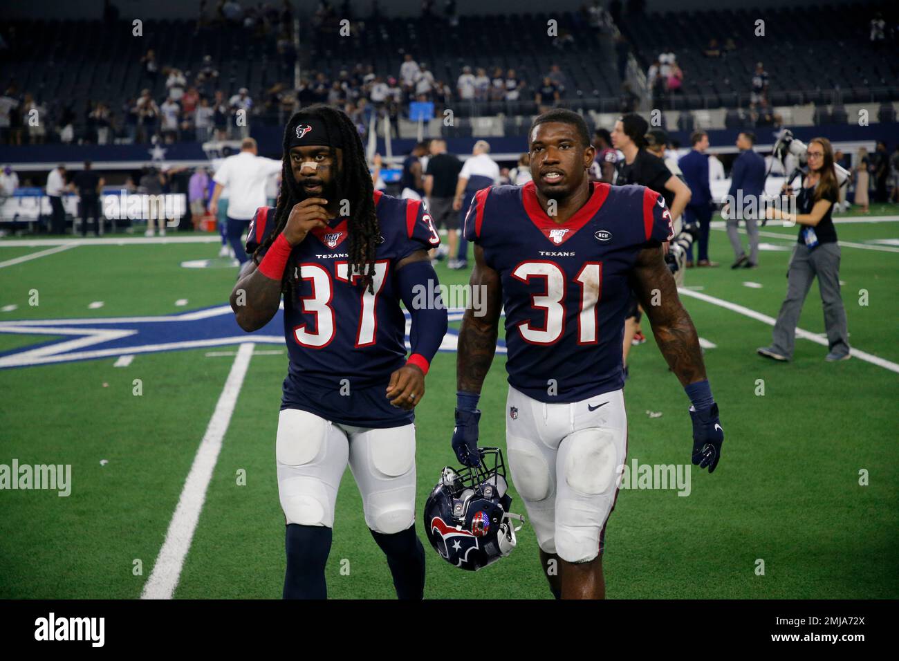 Houston Texans' Jahleel Addae (37) and Karan Higdon (31) walk off the ...