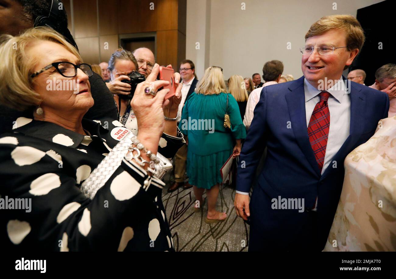 Dianne Peeples, the mother of Lt. Gov. Tate Reeves, takes a photograph ...