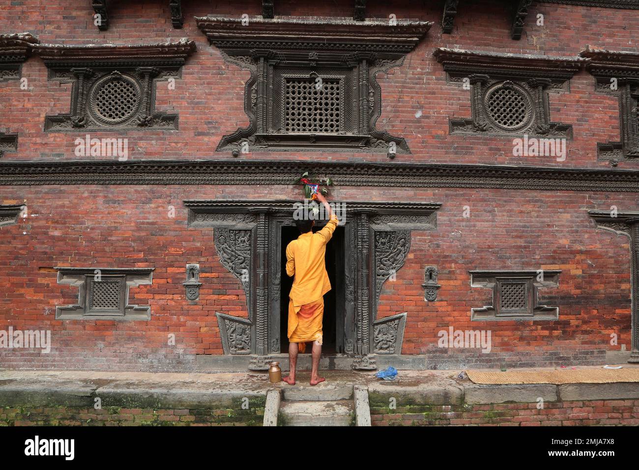 In this Aug. 5, 2019, photo, a Nepalese priest displays a machine made ...