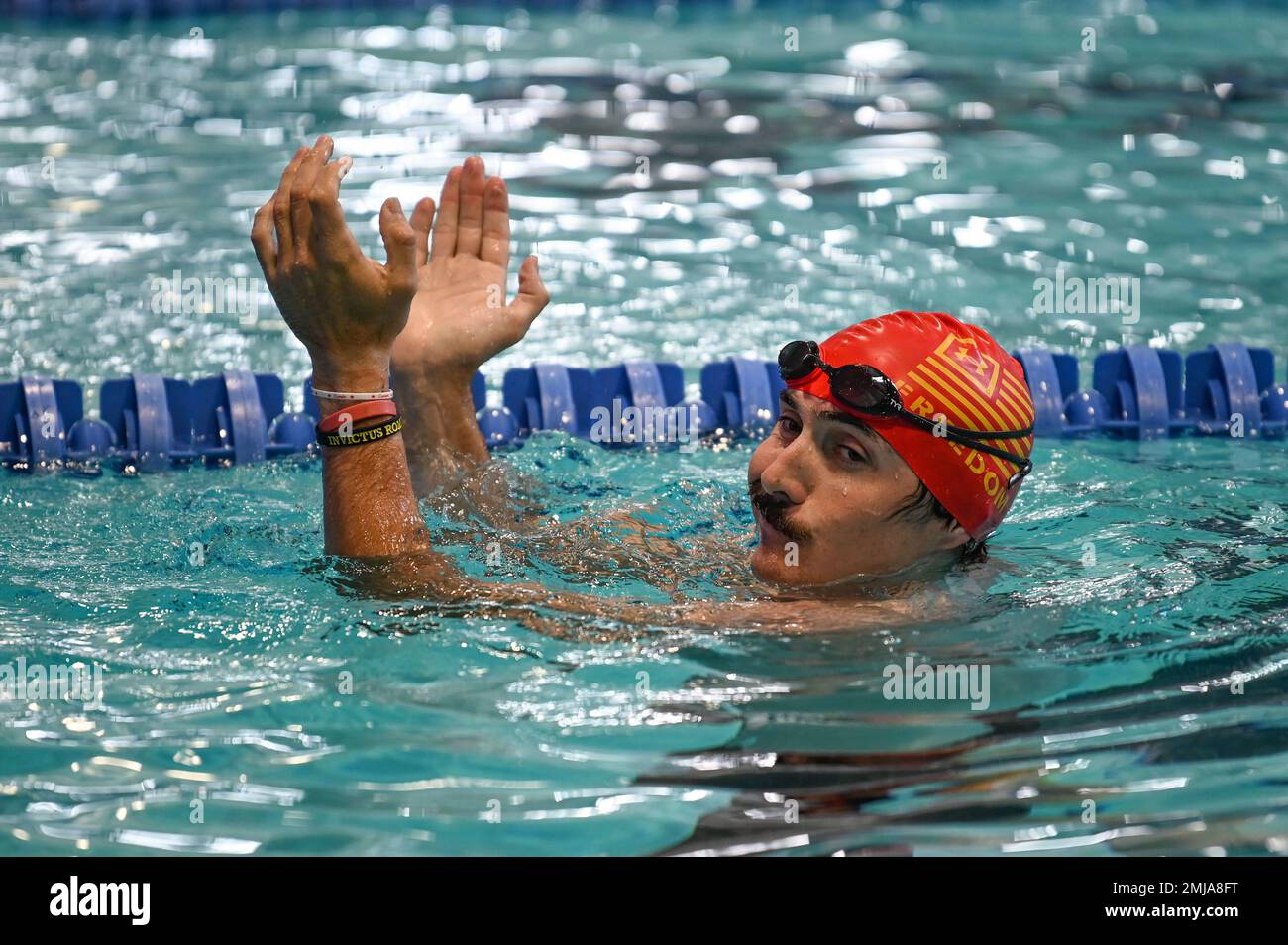 U.S. Marine Corps Sgt. Patrick MacDonald, veteran, competes in swimming ...