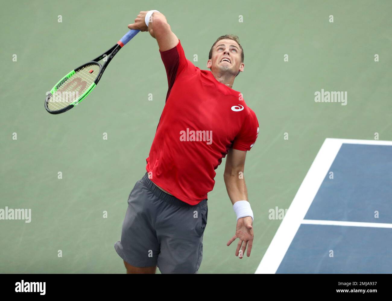 Vasek Pospisil, of Canada, serves to Karen Khachanov, of Russia, during ...