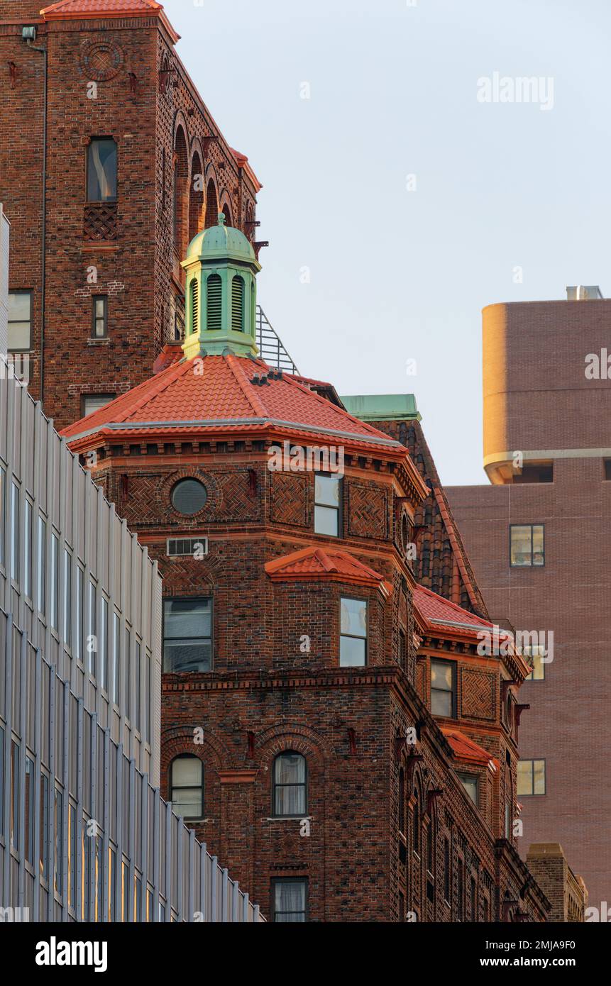 The rich polychrome masonry, red tile and copper-topped cupolas of NH ...