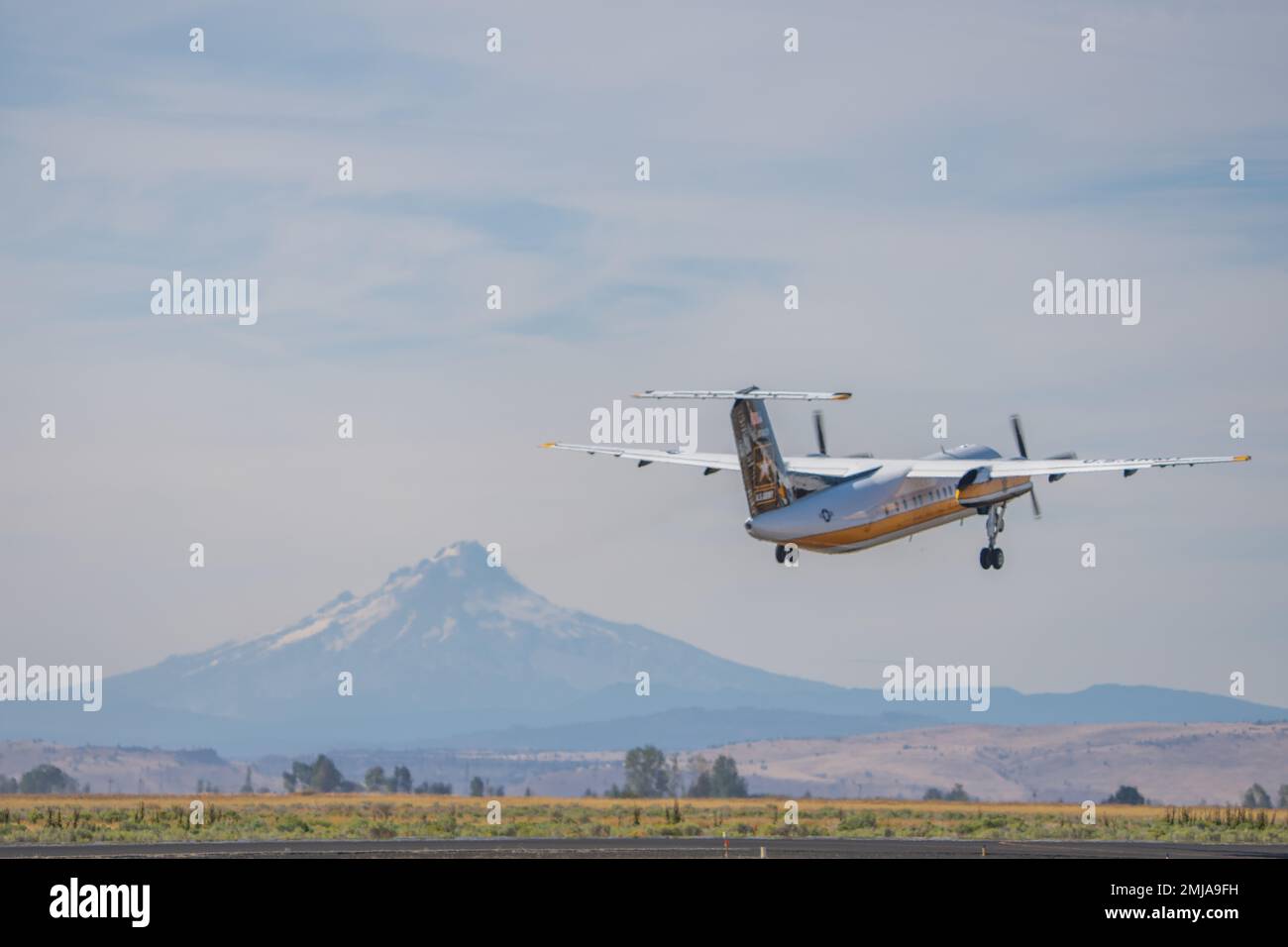 The U.S. Army Parachute Team jump aircraft, the C-147A, takes flight in ...