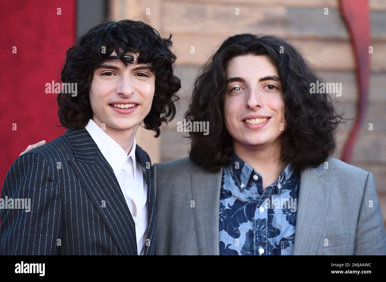 Cast member Finn Wolfhard, left, and his brother Nick Wolfhard arrive ...