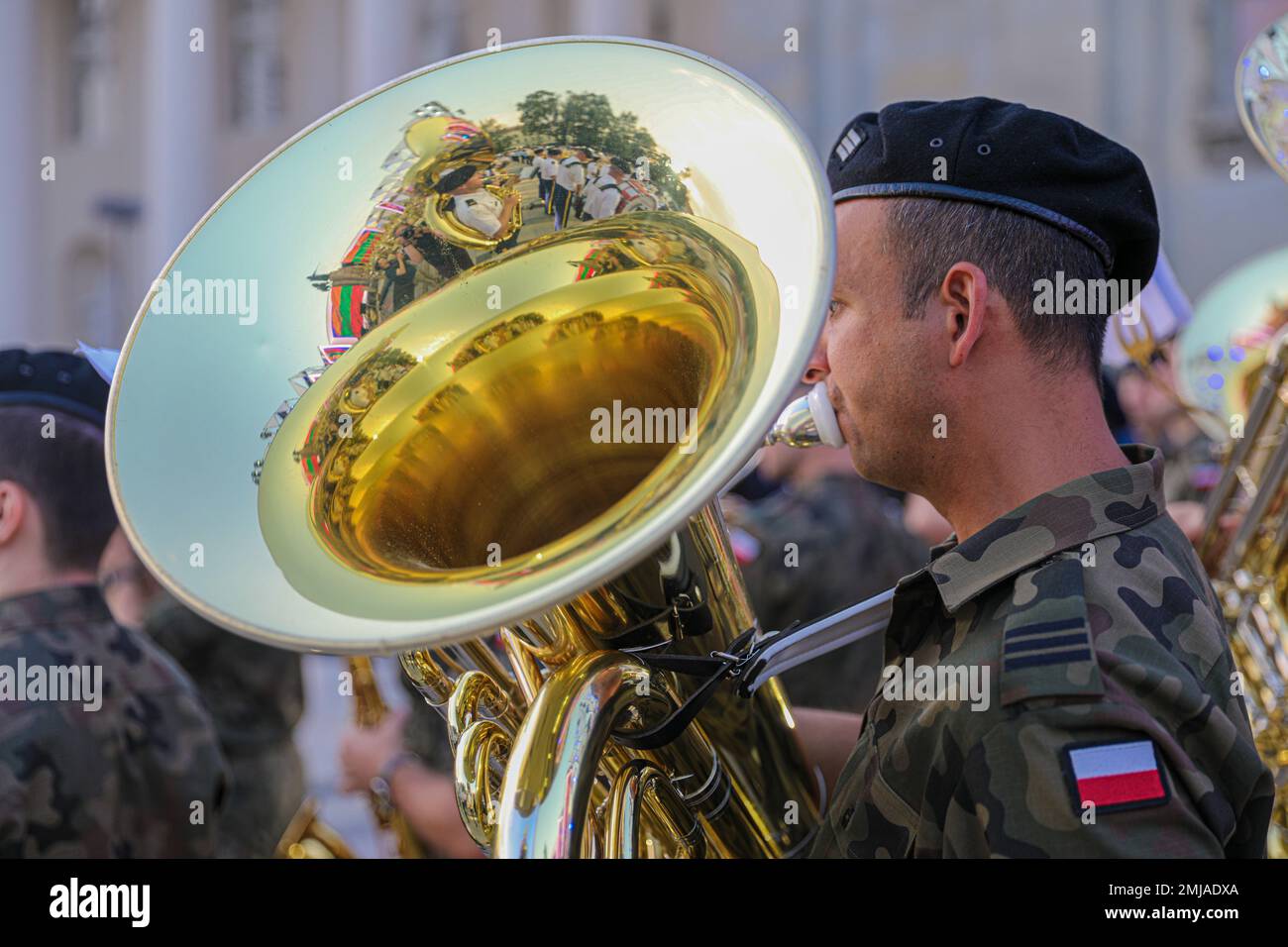 A Polish soldier’s tuba shows the reflection of U.S. Soldiers of the ...