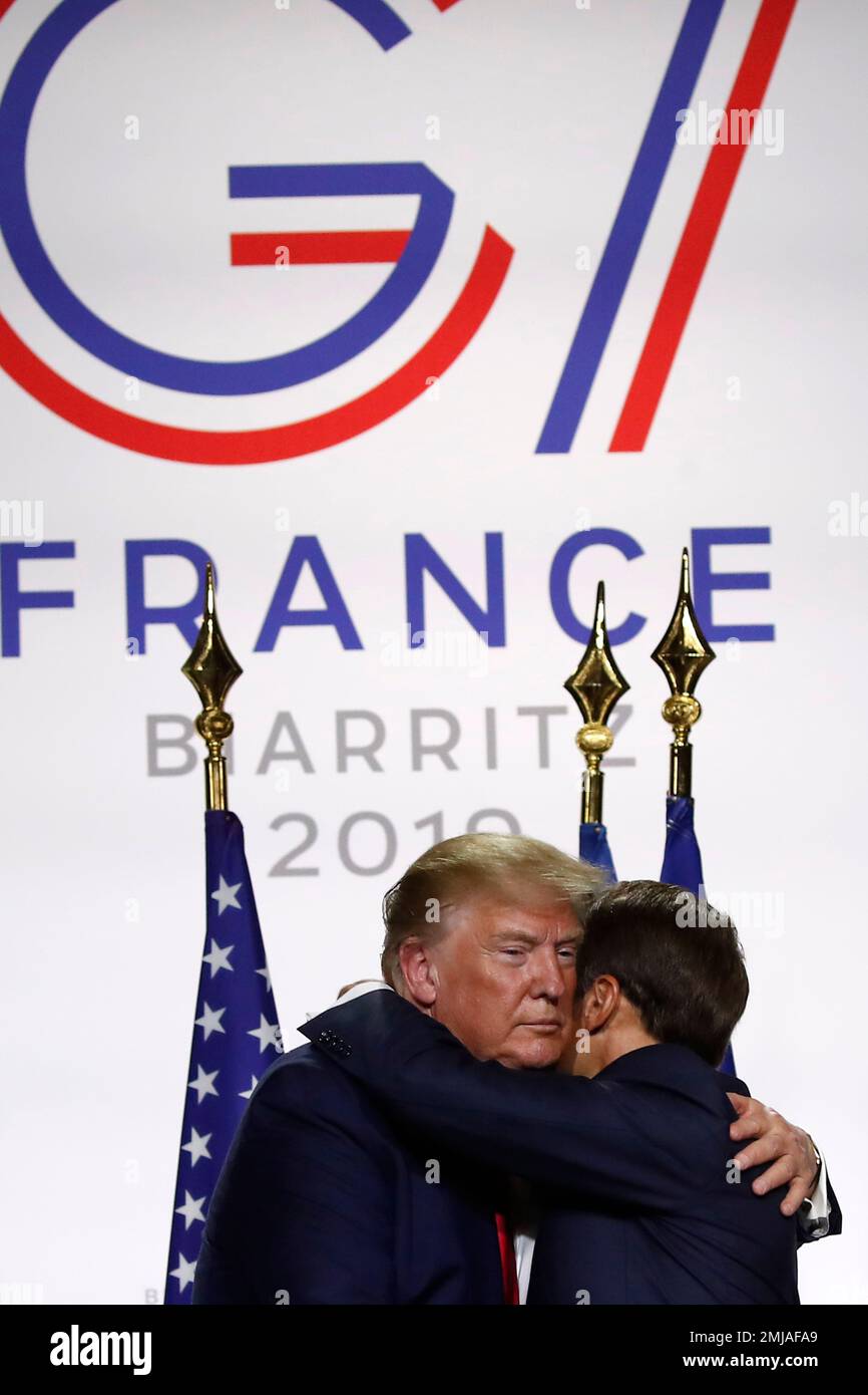 U.S President Donald Trump and French President Emmanuel Macron hug ...