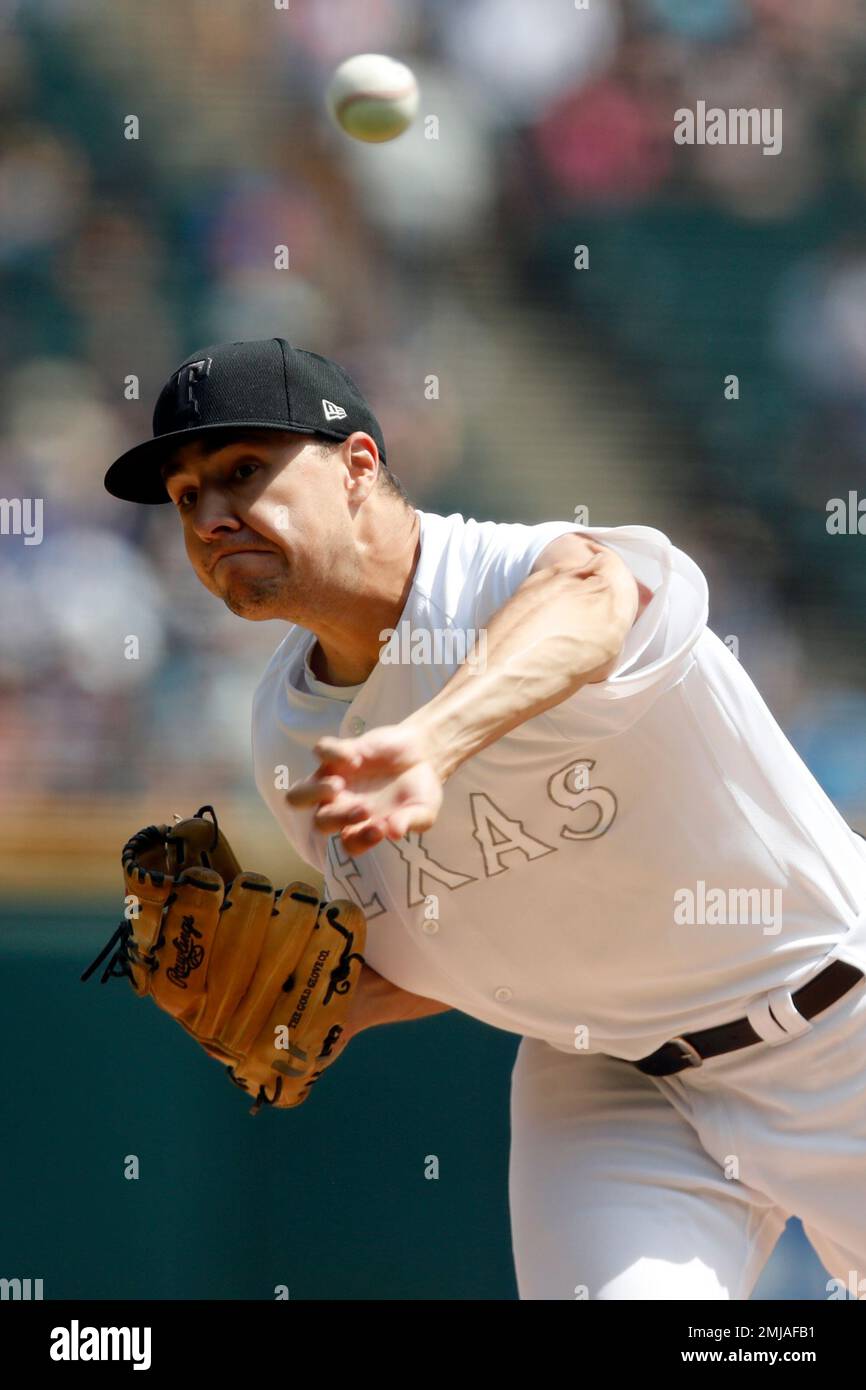 Texas Rangers starting pitcher Brock Burke delivers during the first ...