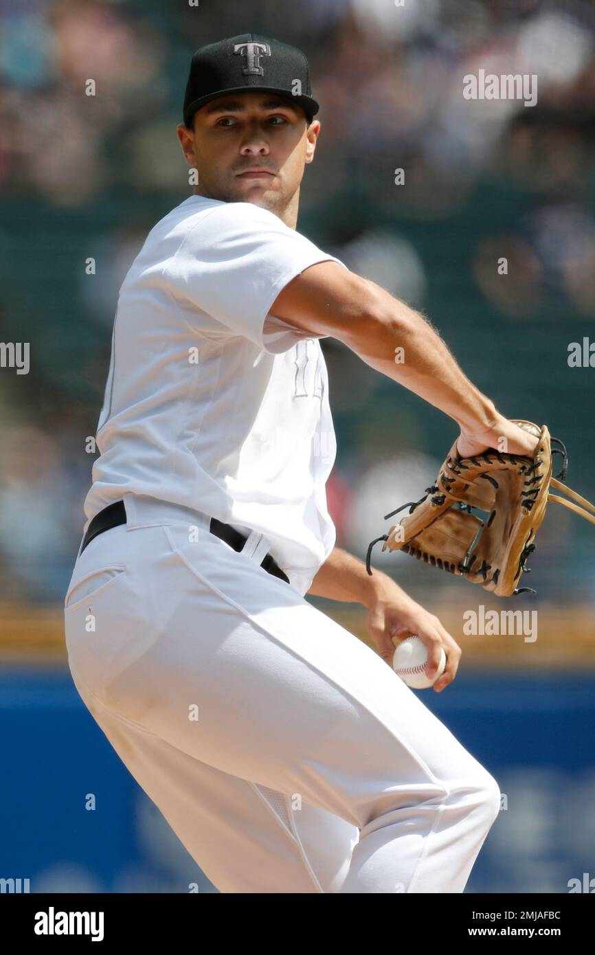Texas Rangers starting pitcher Brock Burke delivers during the first ...