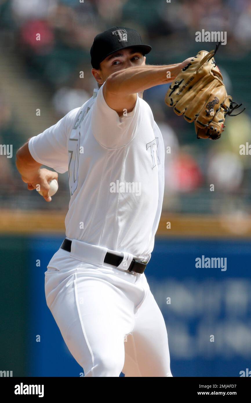 Texas Rangers starting pitcher Brock Burke delivers during the first ...