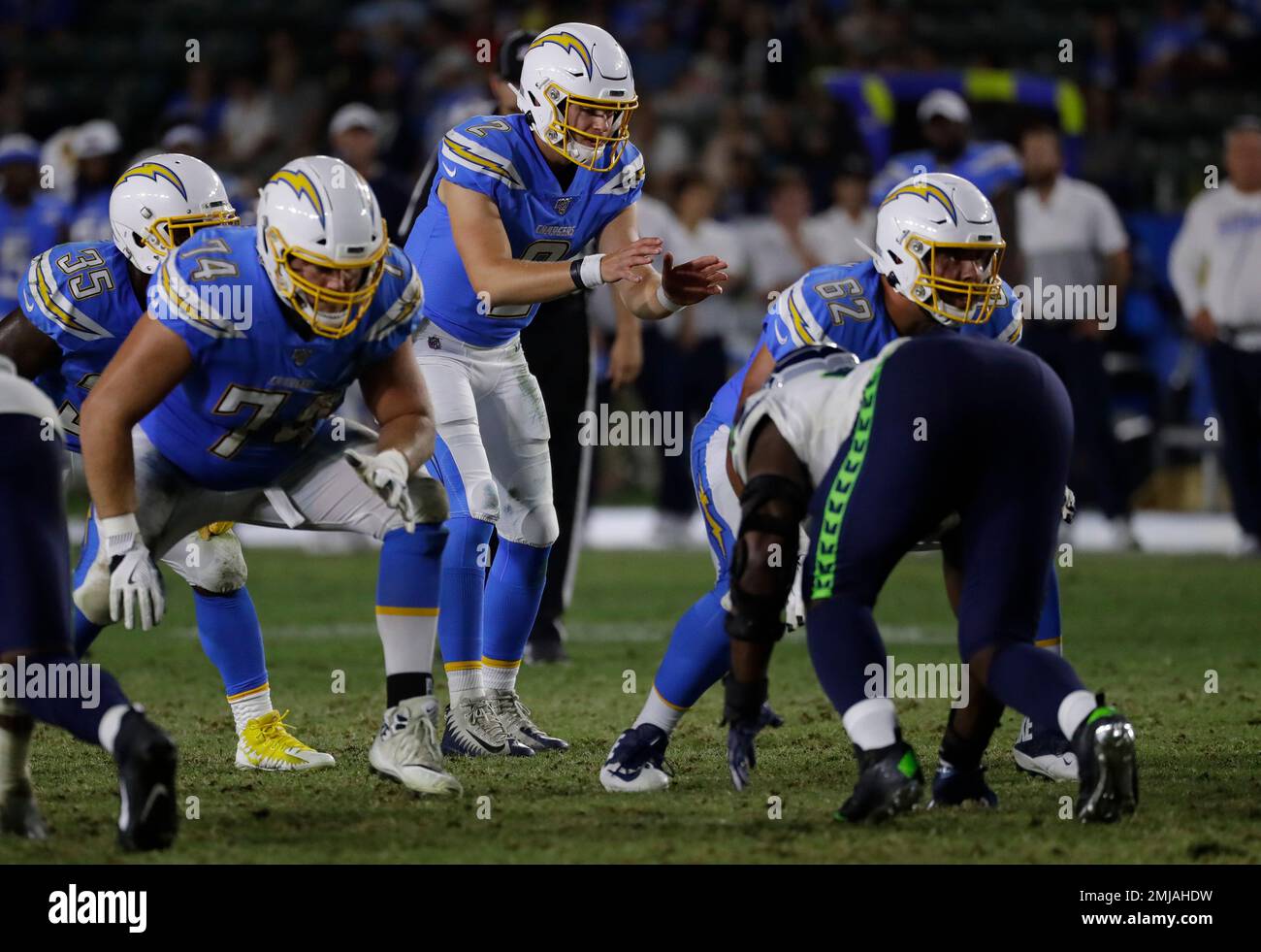 Los Angeles Chargers quarterback Easton Stick (2) takes a snap against ...