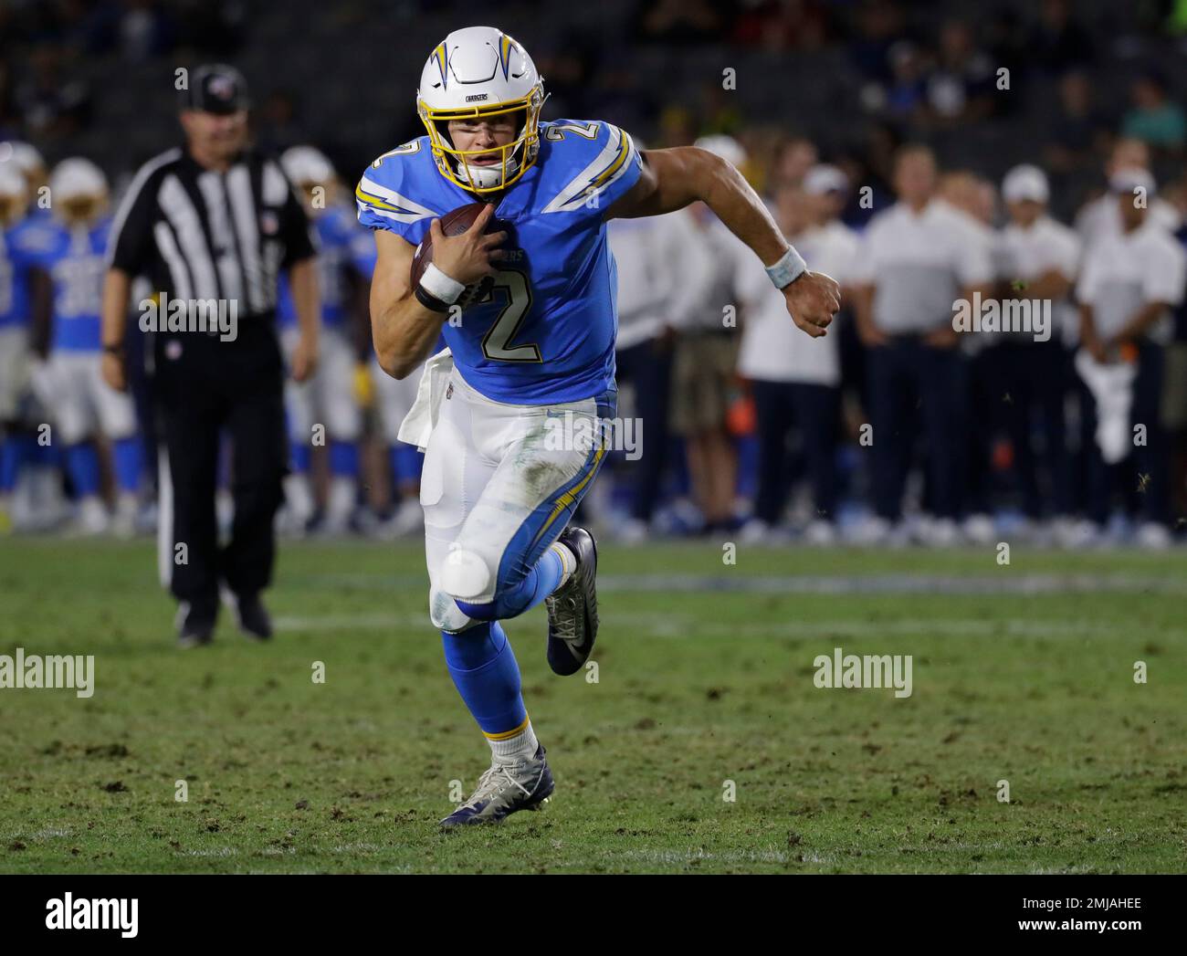 Los Angeles Chargers quarterback Easton Stick scrambles against the ...