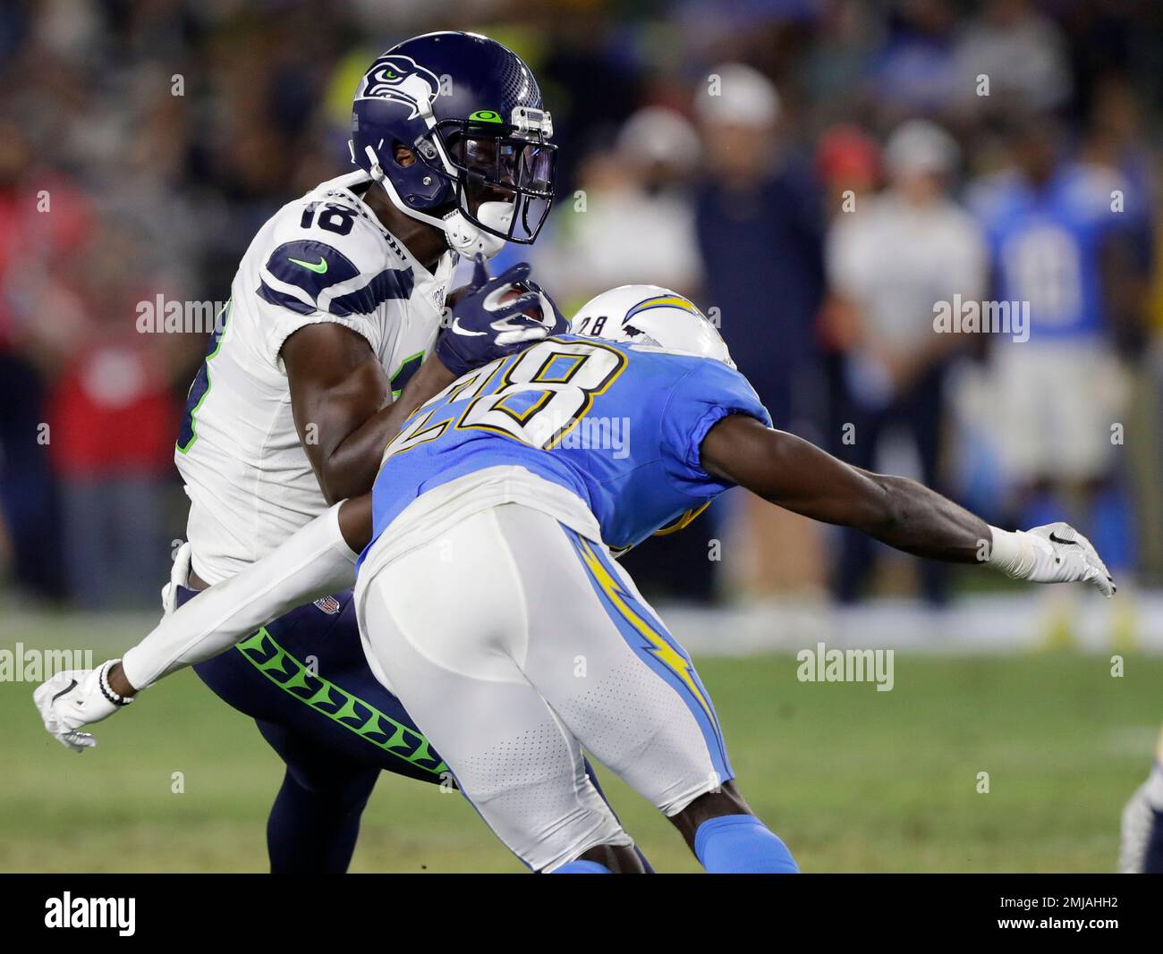 Seattle Seahawks wide receiver Jaron Brown (18) is stopped by Los ...