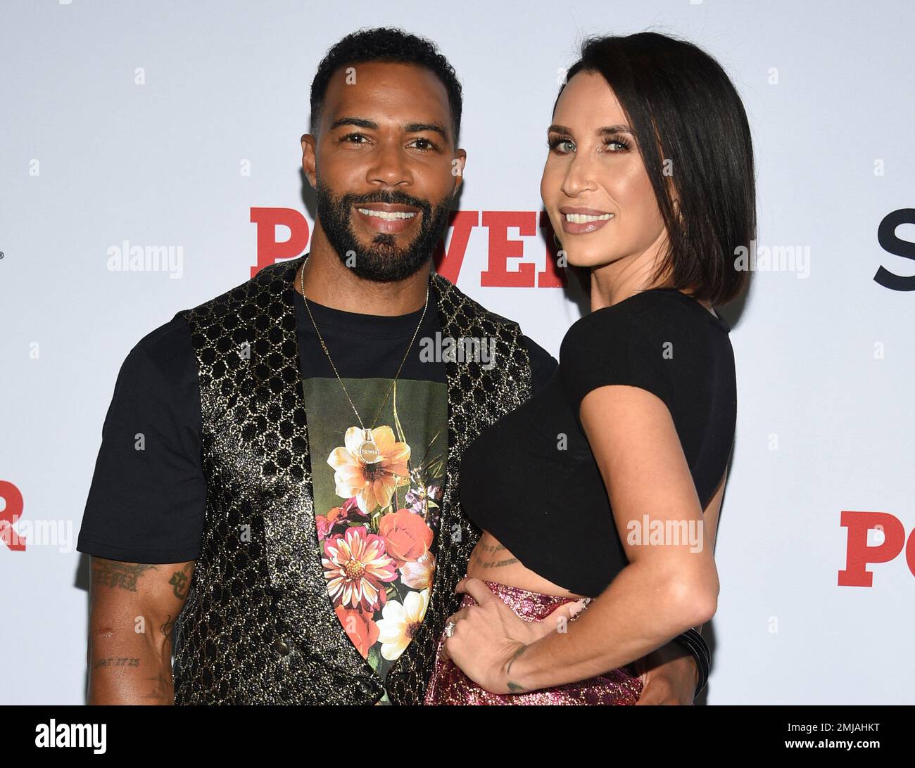 Actor Omari Hardwick, left, and girlfriend Jennifer Pfautch attend the ...