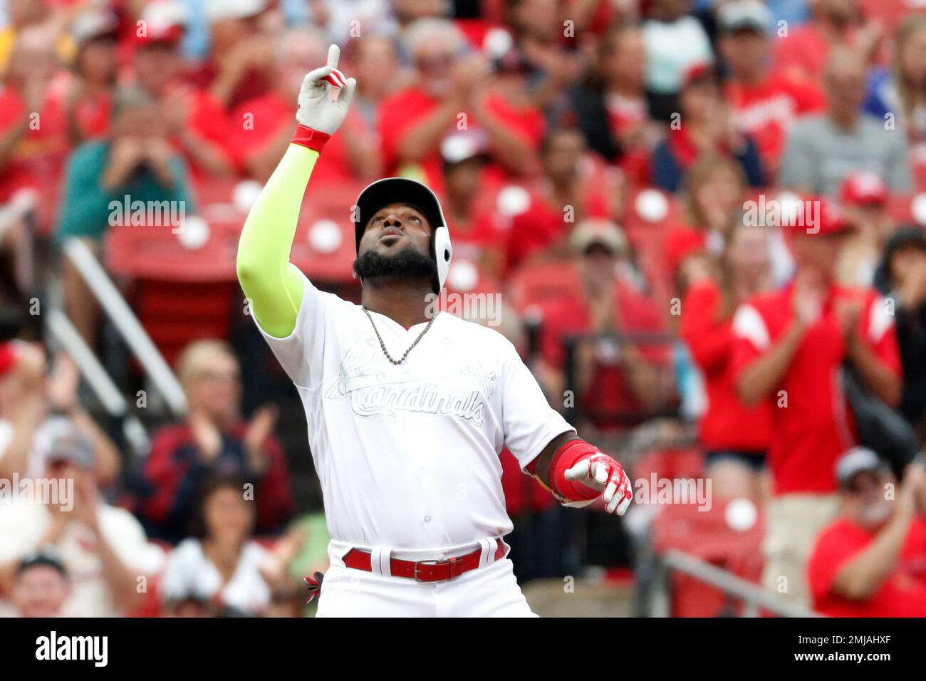 St. Louis Cardinals' Marcell Ozuna celebrates after hitting a triple ...