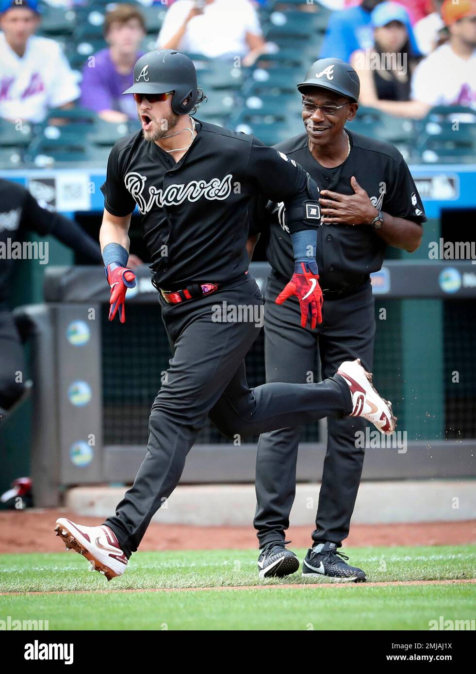 Atlanta Braves third base coach Ron Washington, right, cheers Josh ...