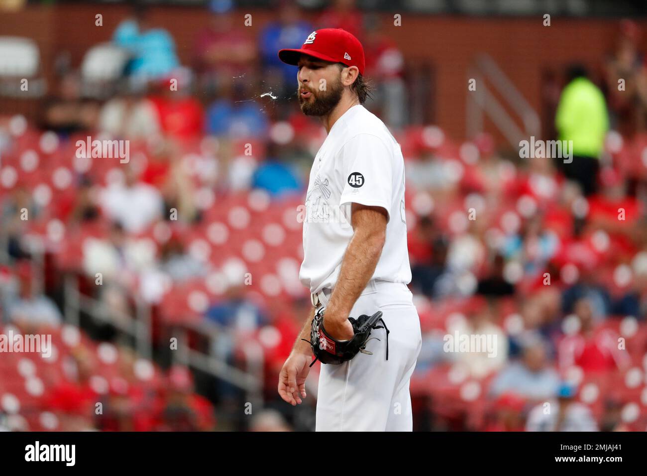 St. Louis Cardinals starting pitcher Michael Wacha spits after giving ...