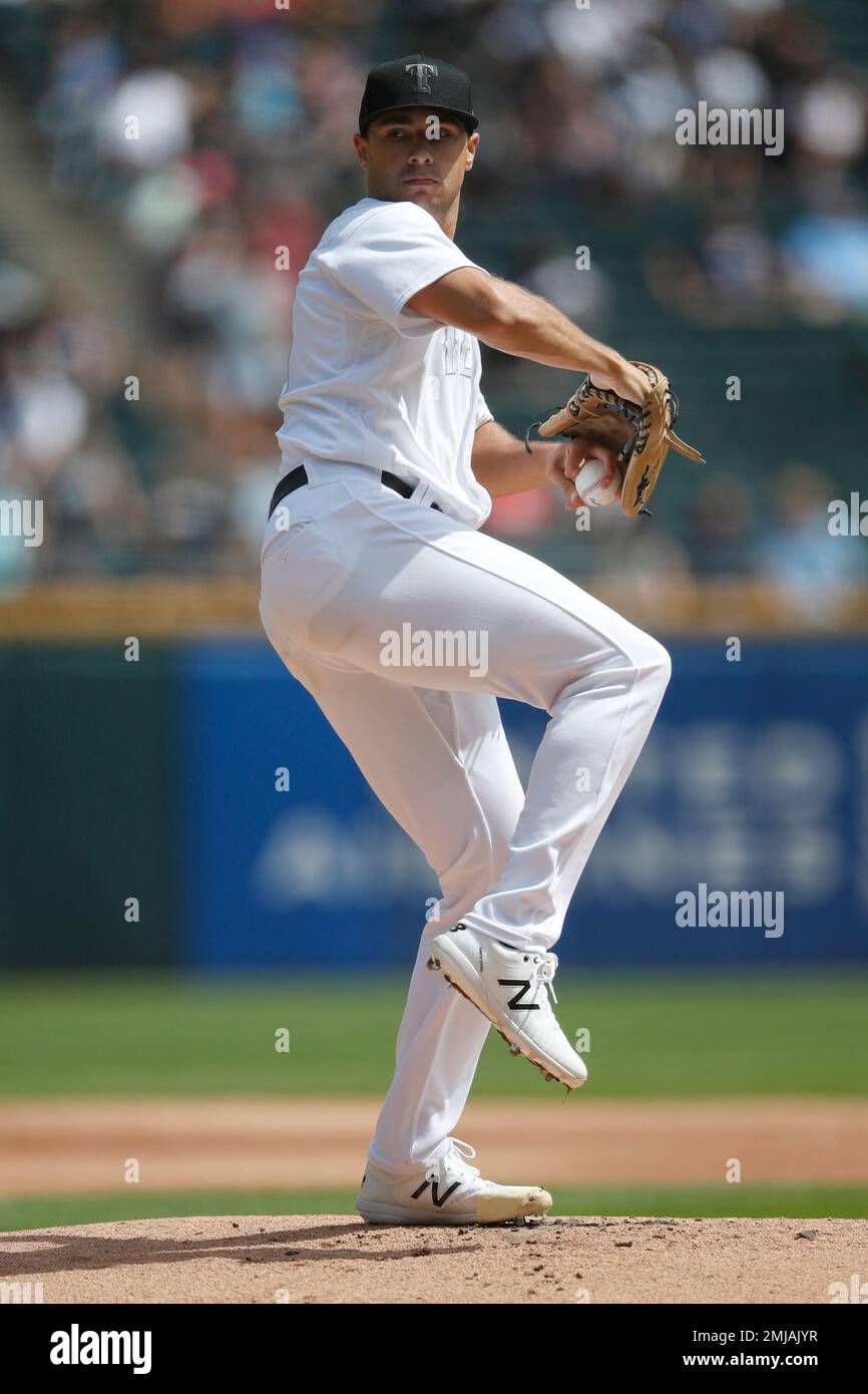 Texas Rangers starting pitcher Brock Burke delivers during the first ...