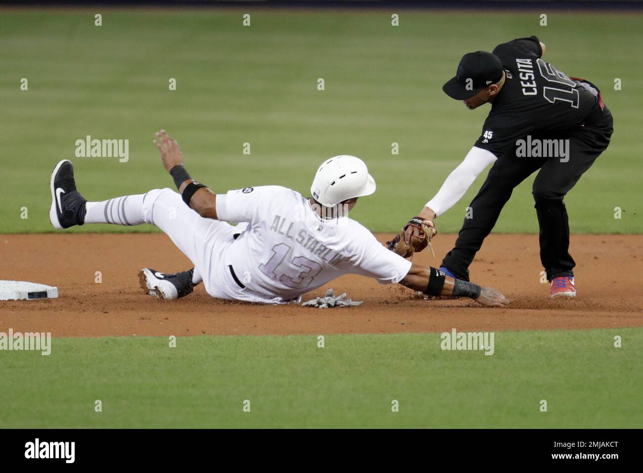 Miami Marlins' Starlin Castro (13) is tagged out by Philadelphia ...