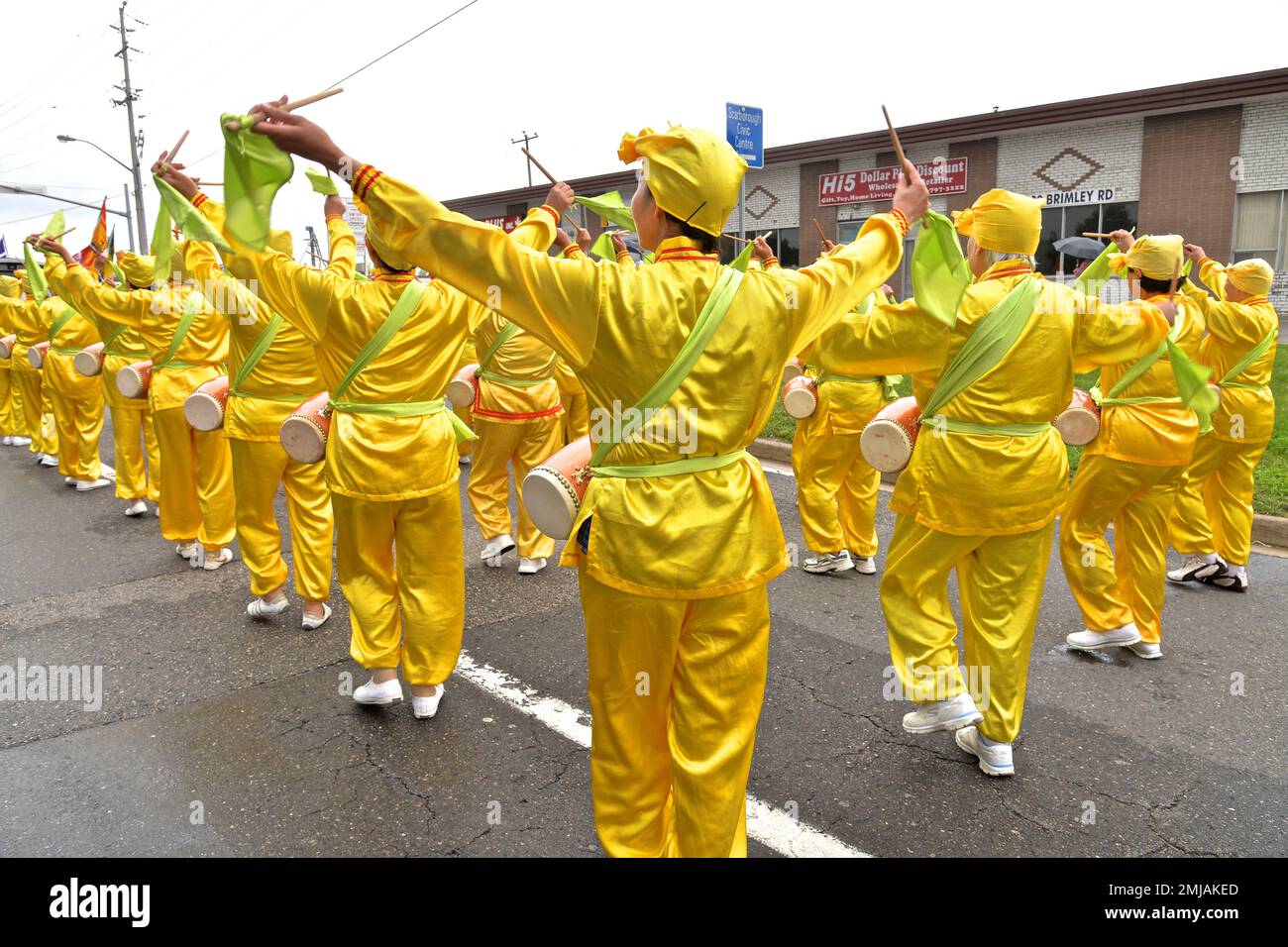 Women dressing in traditional Chinese costumes playing the drum dance ...