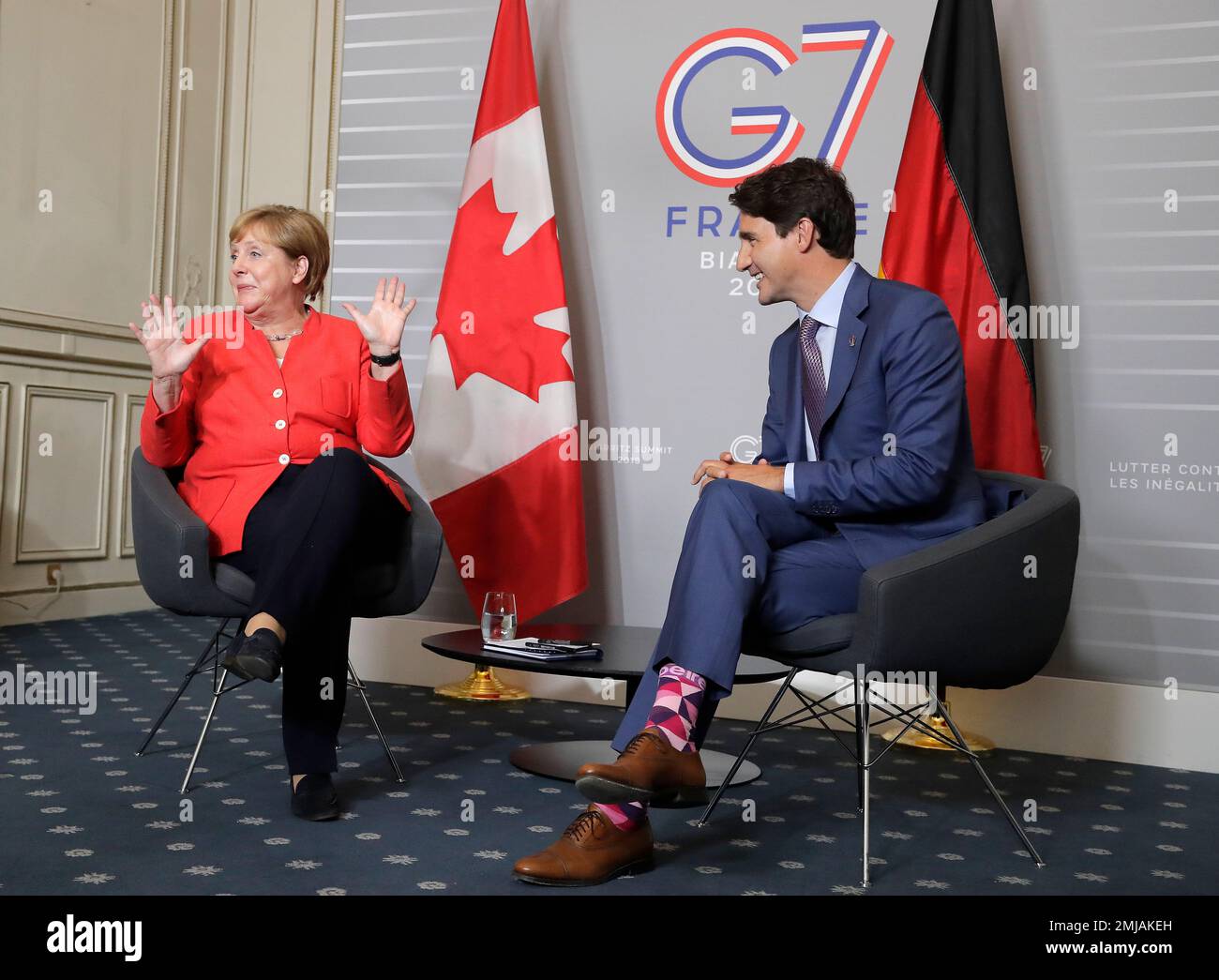 German Chancellor Angela Merkel reacts as she meets with Canadian Prime ...