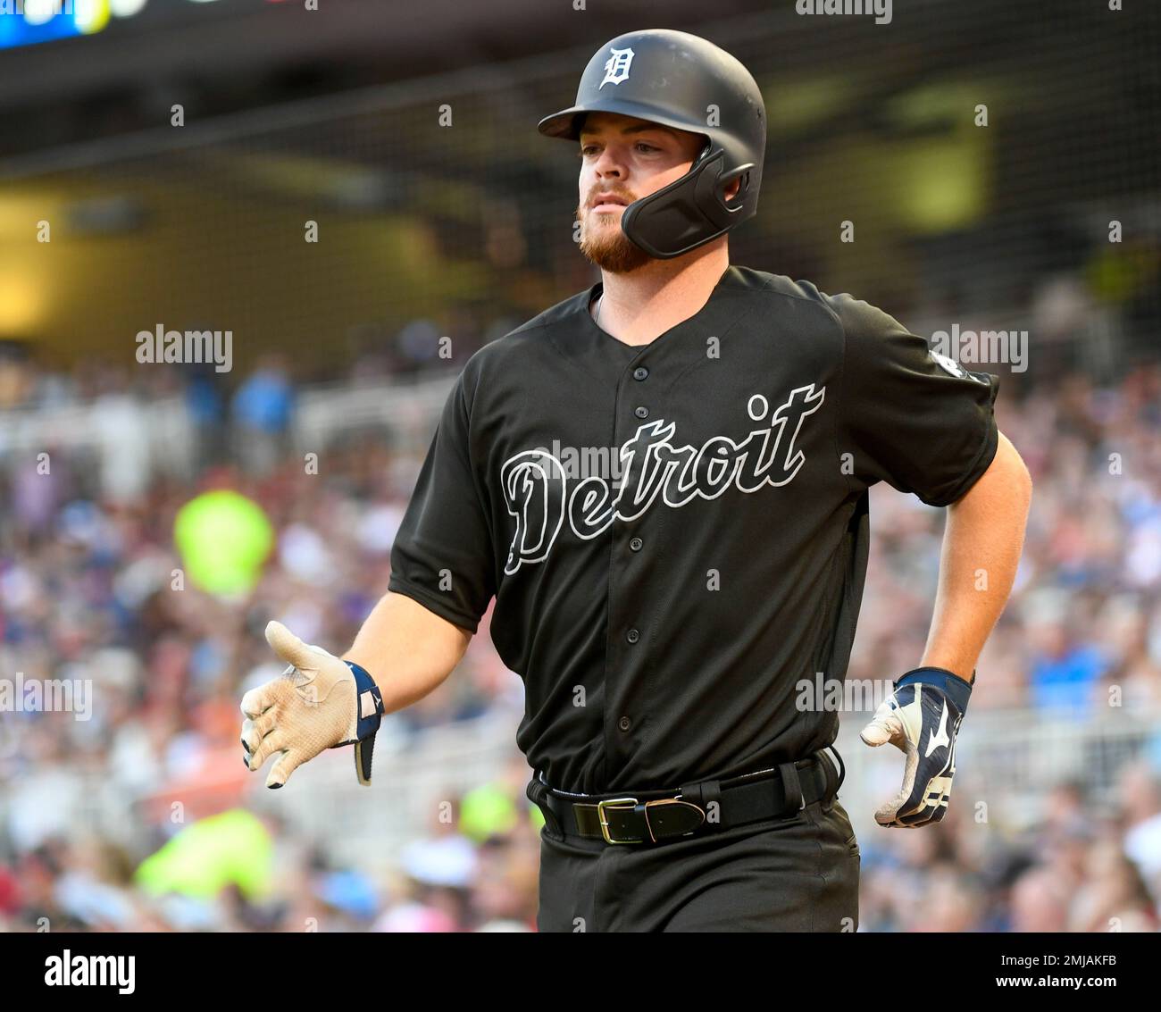 Detroit Tigers catcher Jake Rogers returns to the dugout after scoring ...