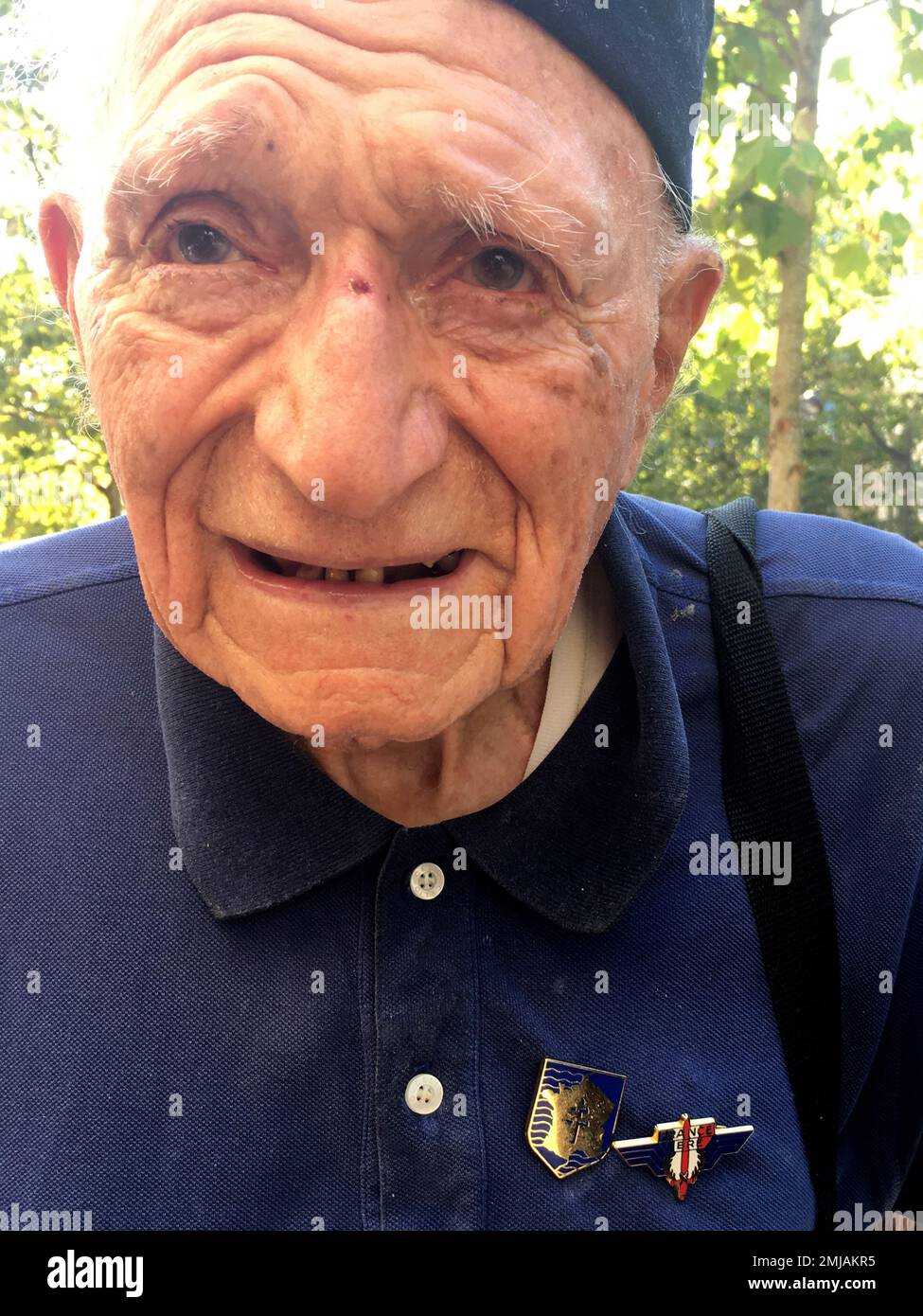 Roger Acher, 96, of France, arrives at a parade marking the 75th ...