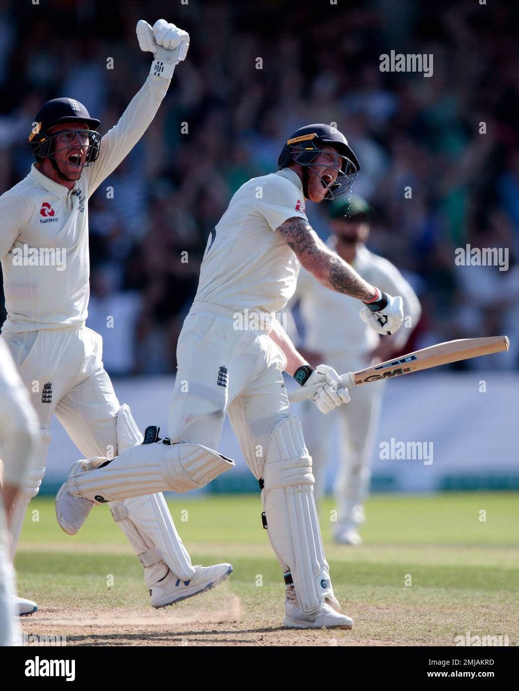 England's Ben Stokes, right, with Jack Leach celebrates after scoring ...