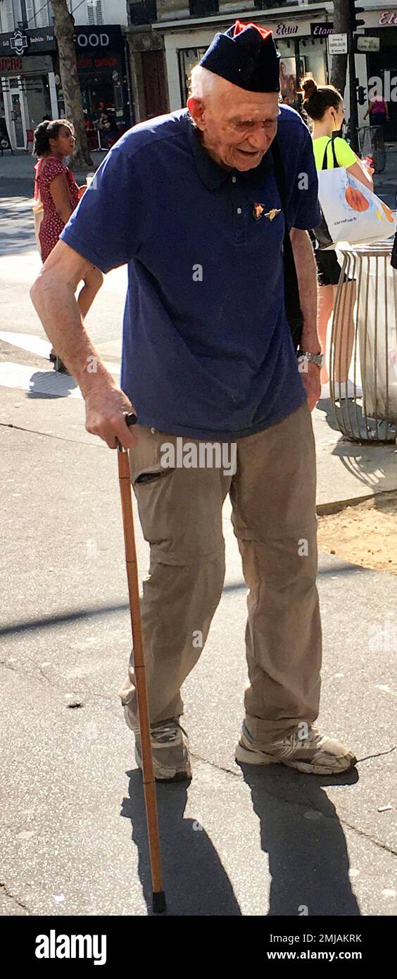 Roger Acher, 96, of France, arrives at a parade marking the 75th ...