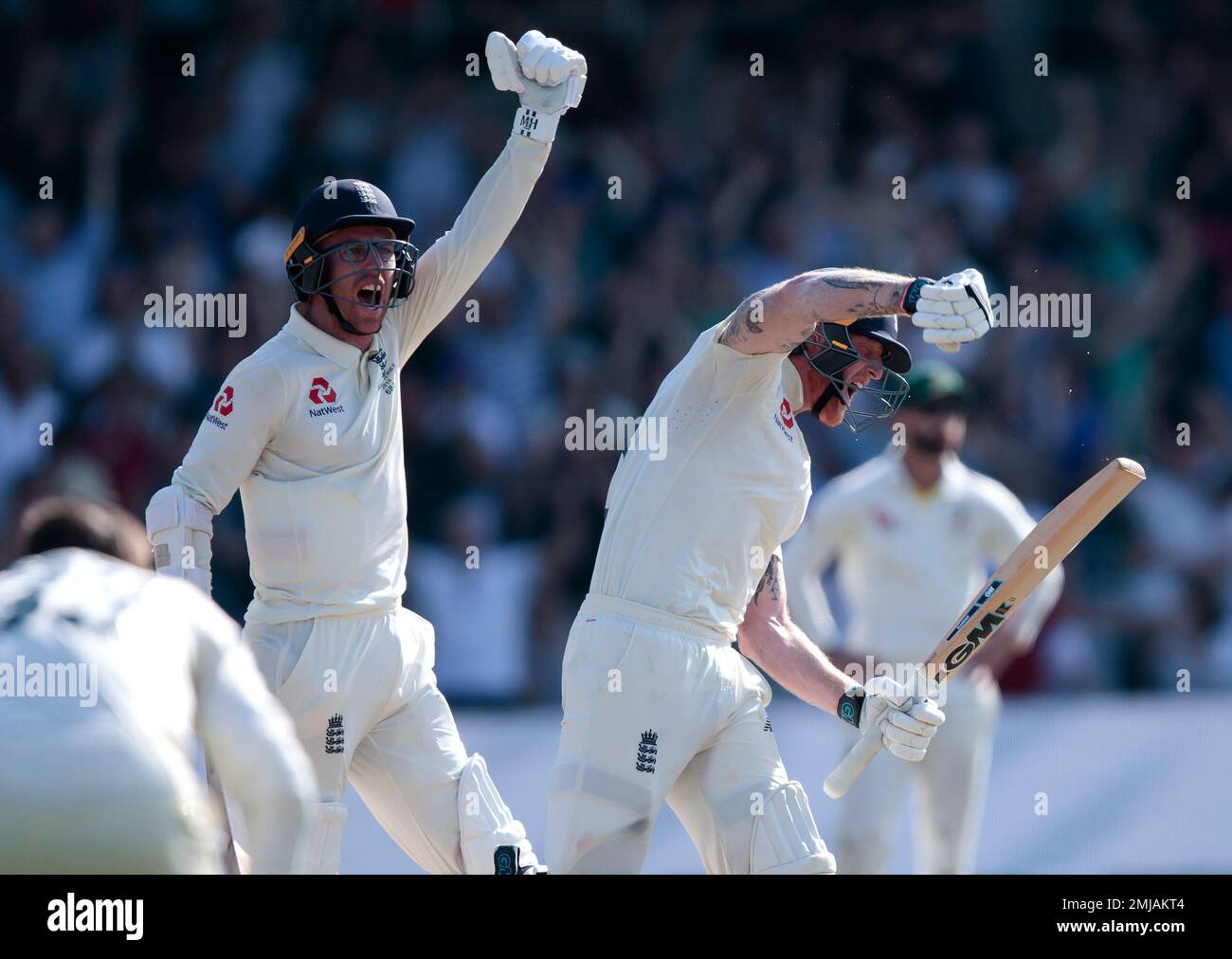 England's Ben Stokes, right, with Jack Leach celebrates after scoring ...