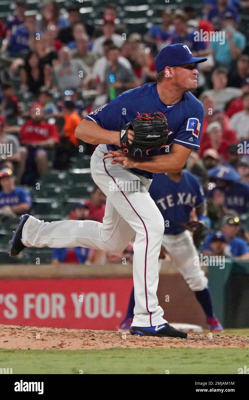 Texas Rangers relief pitcher Locke St. John pitches against the Los ...