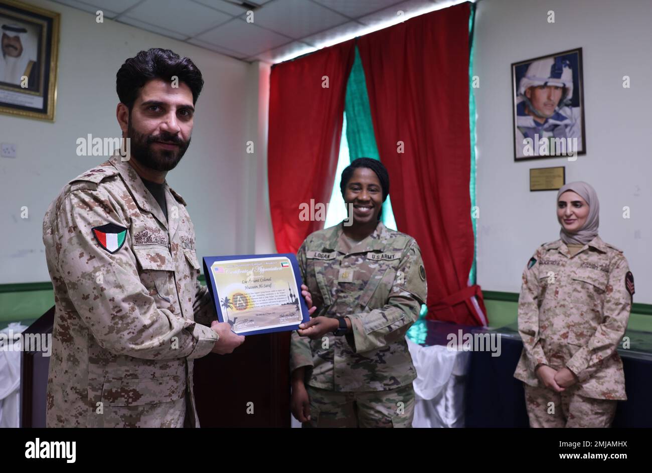 Kuwait Army doctor, Lt. Col. Hussain Al-Saraf receives a certificate of ...
