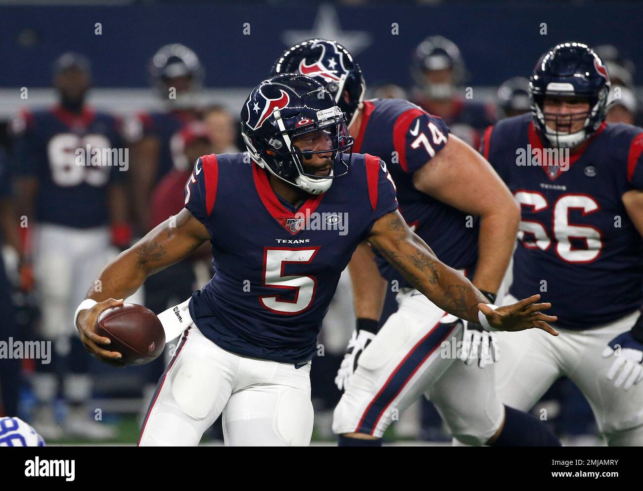 Houston Texans quarterback Joe Webb (5) scrambles out of the pocket in ...