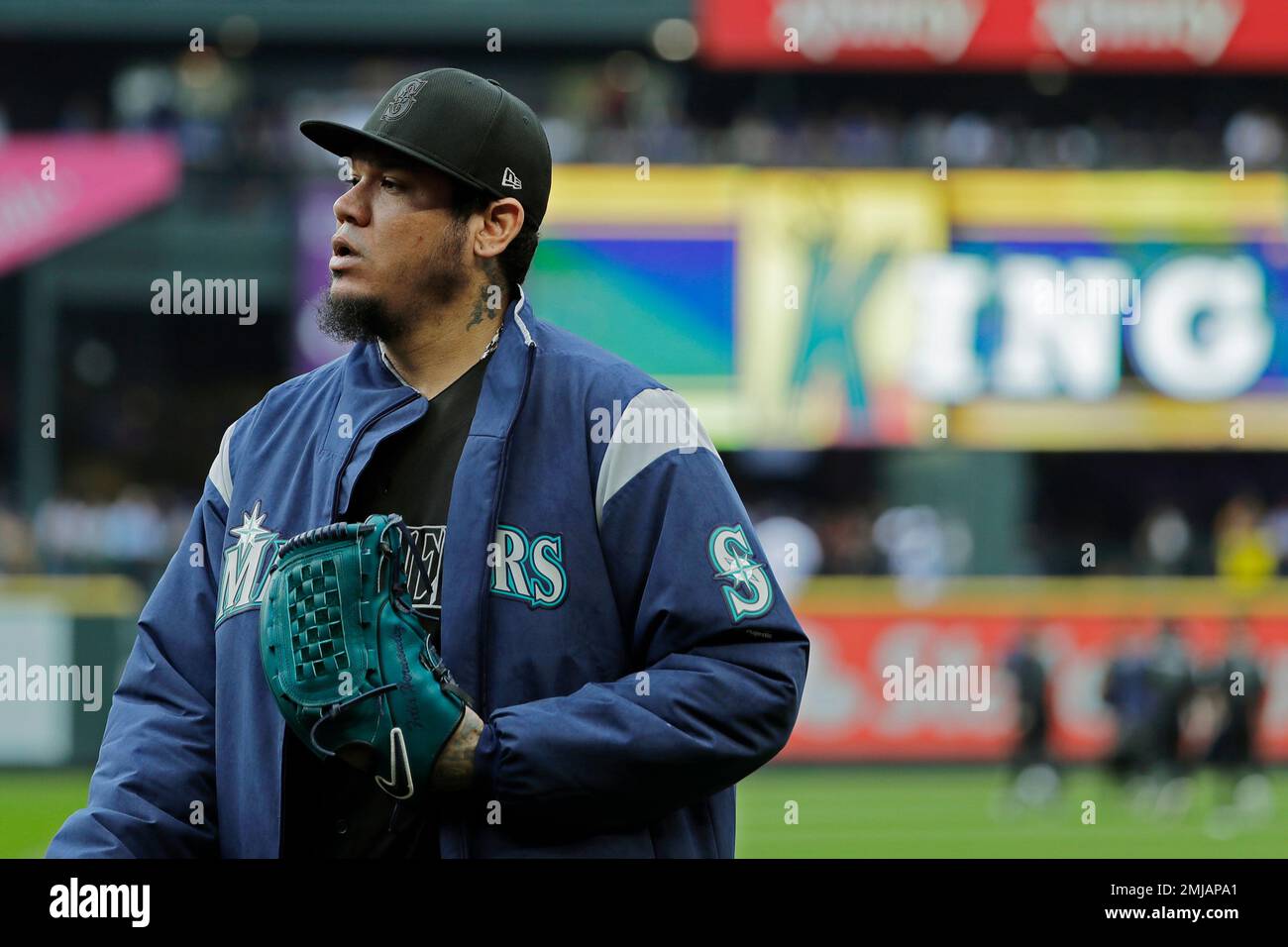 Seattle Mariners starting pitcher Felix Hernandez walks from the dugout ...