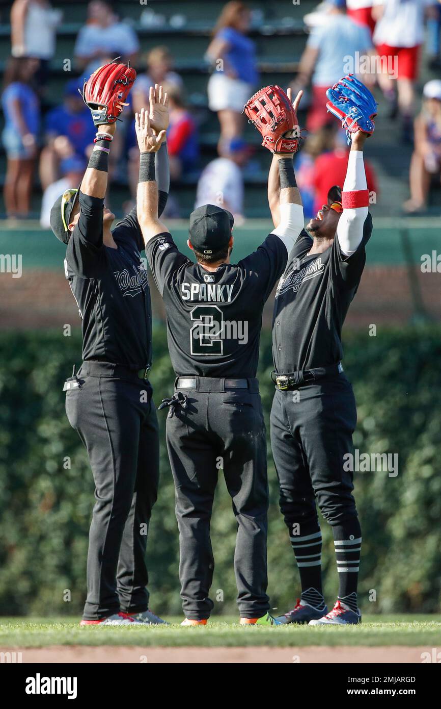Washington Nationals' Juan Soto, left, Adam Eaton, center, and Victor ...