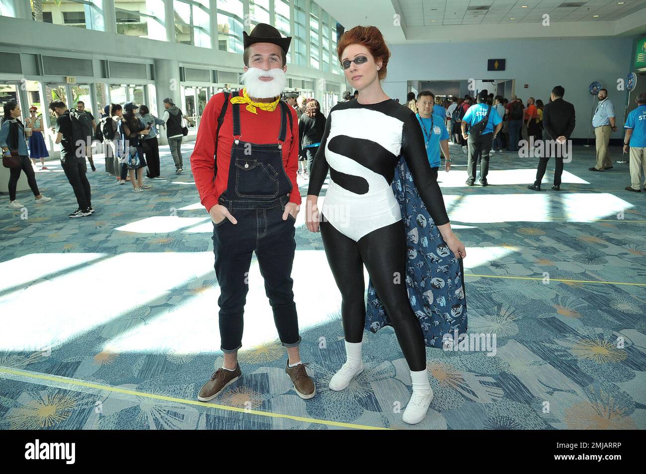 Ryan Wenzel, of Chicago, dressed as Stinky Pete, left, and Allie Ring ...