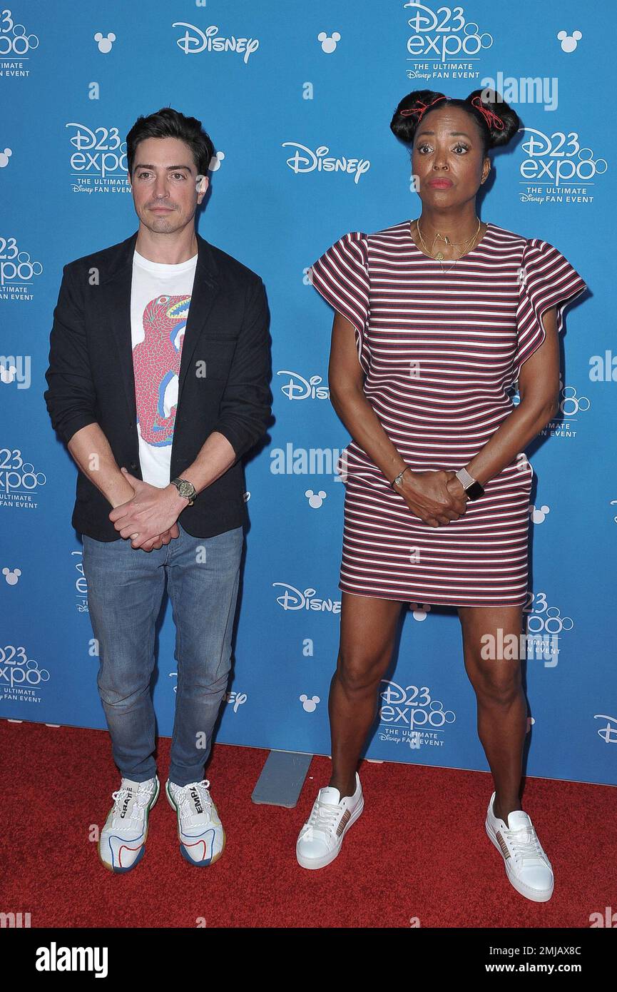 Ben Feldman, left, and Aisha Tyler attend the Disney+ press line at the ...