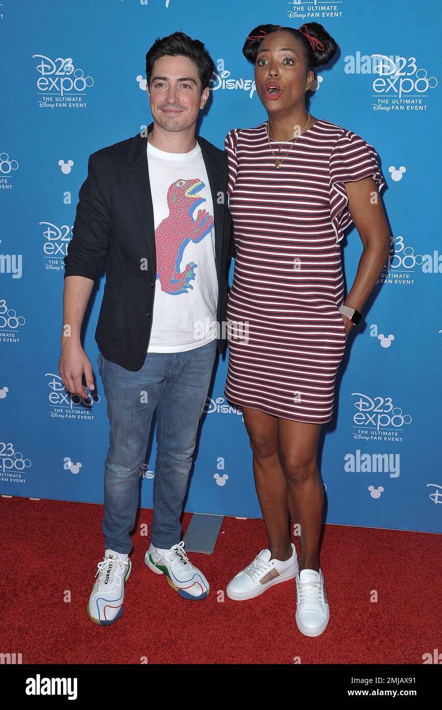 Ben Feldman, left, and Aisha Tyler attend the Disney+ press line at the ...