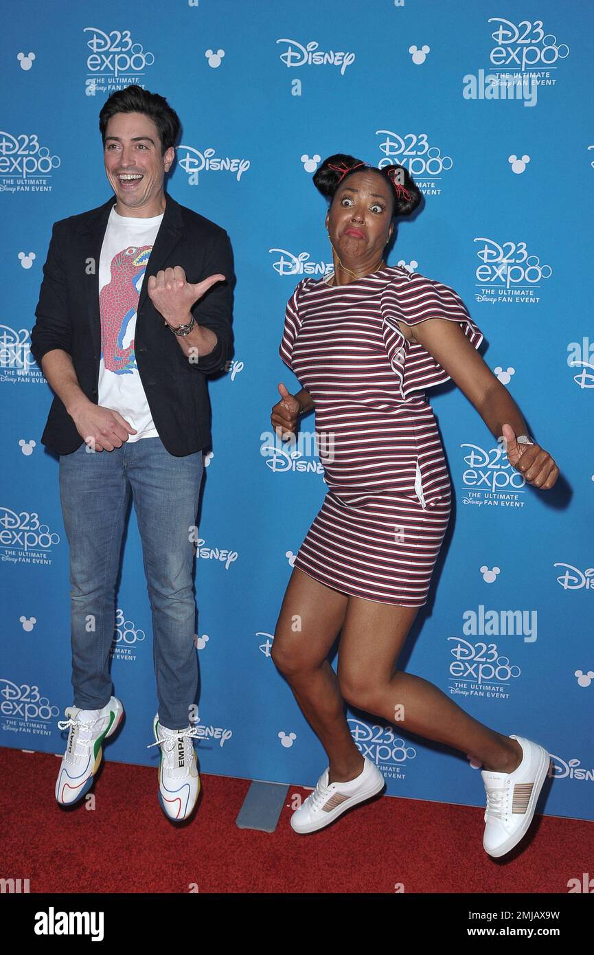 Ben Feldman, left, and Aisha Tyler attend the Disney+ press line at the ...