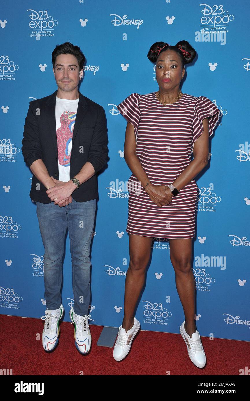 Ben Feldman, left, and Aisha Tyler attend the Disney+ press line at the ...