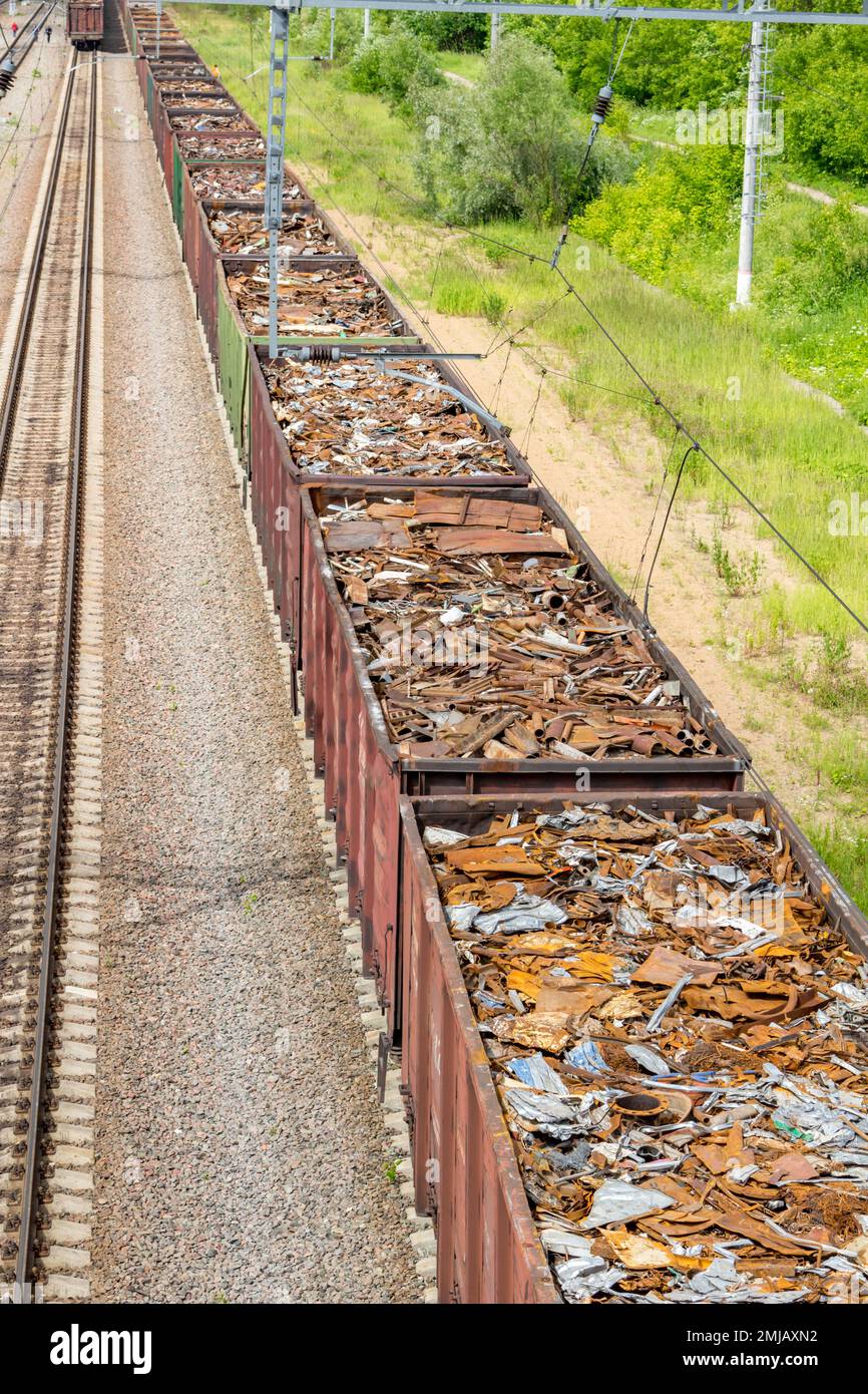 Transportation of scrap metal by rail. Scrap metal in railway wagons ...