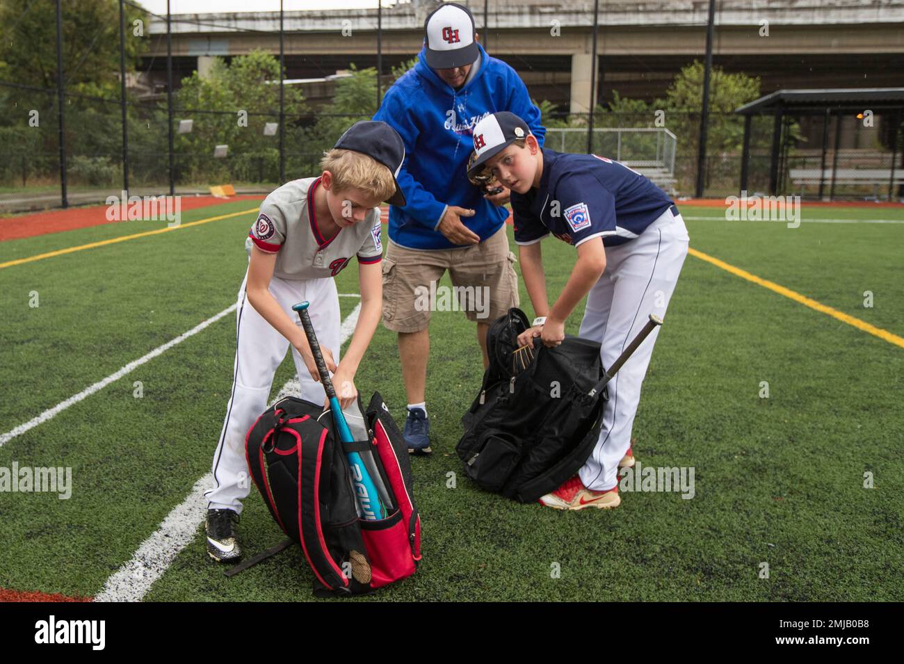David Fox, center, with his sons Dewey, right. and Jimmy gather their ...