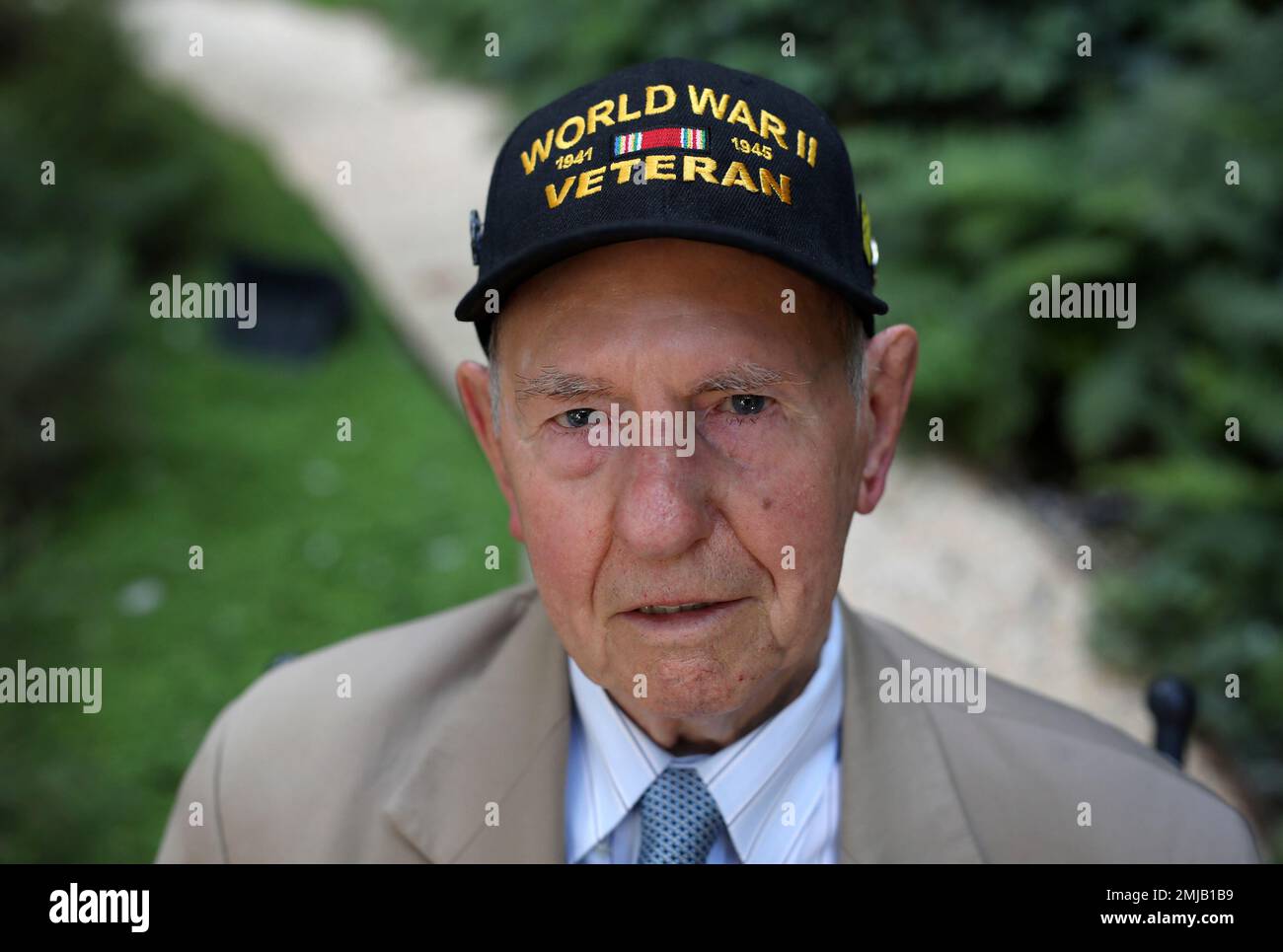 Donald Cobb, 95, of the US Navy, poses during an interview with the ...