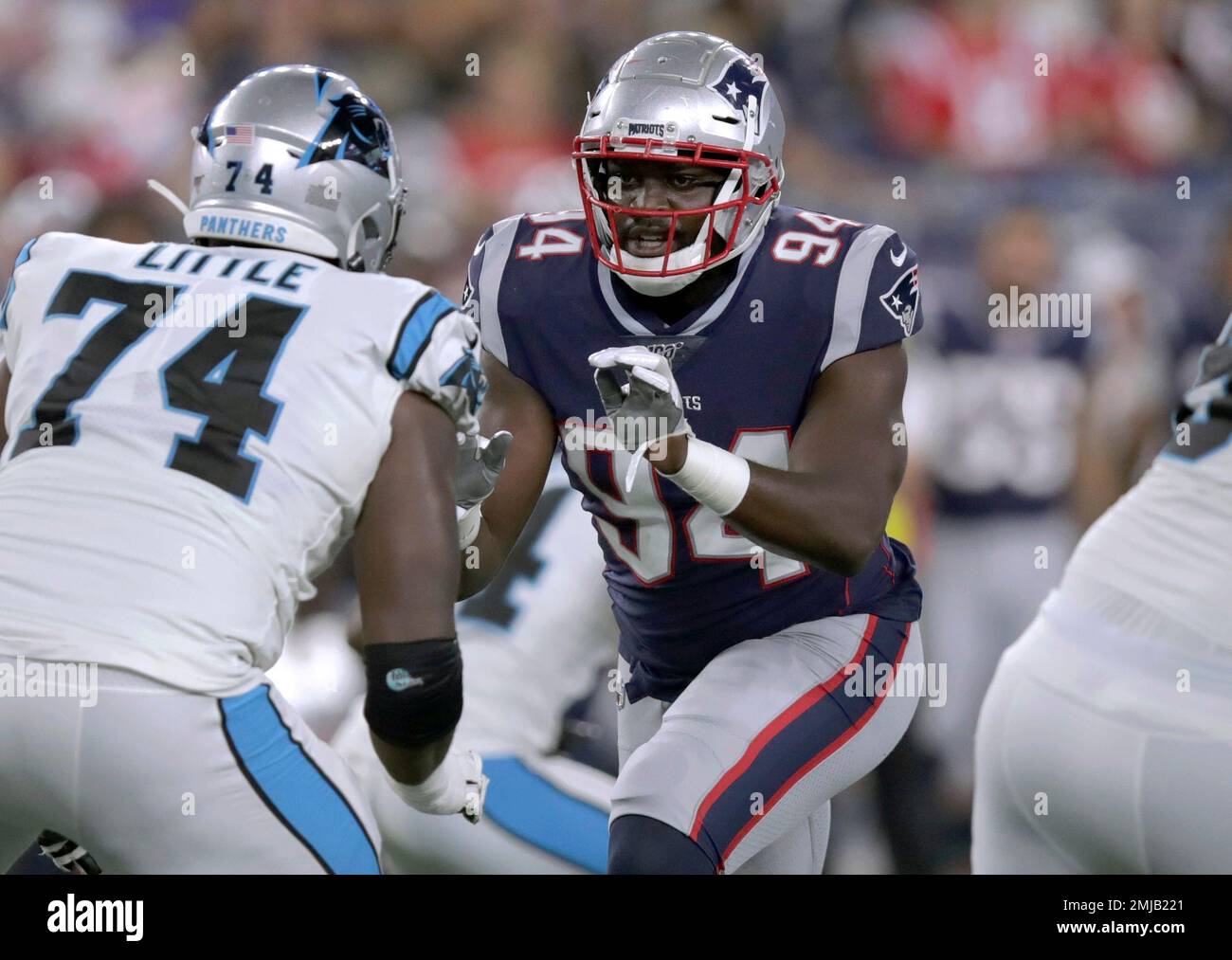 New England Patriots linebacker Ufomba Kamalu (94) tries to get past ...