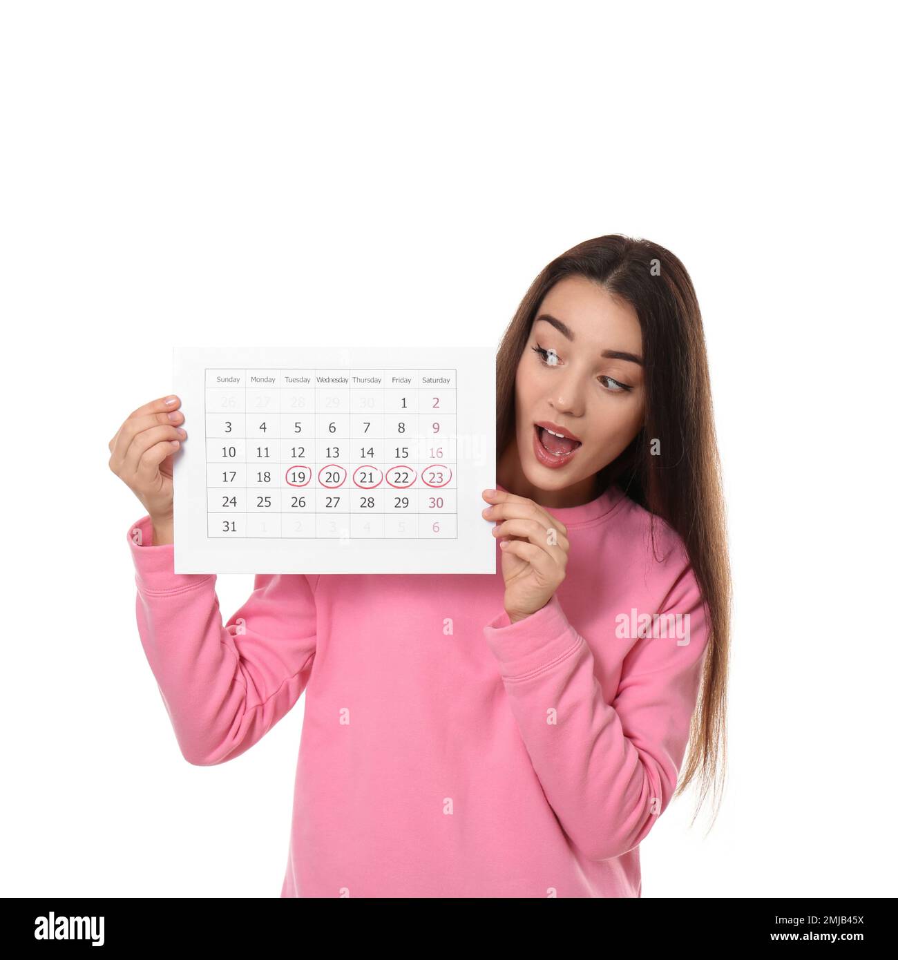 Young woman holding calendar with marked menstrual cycle days isolated ...