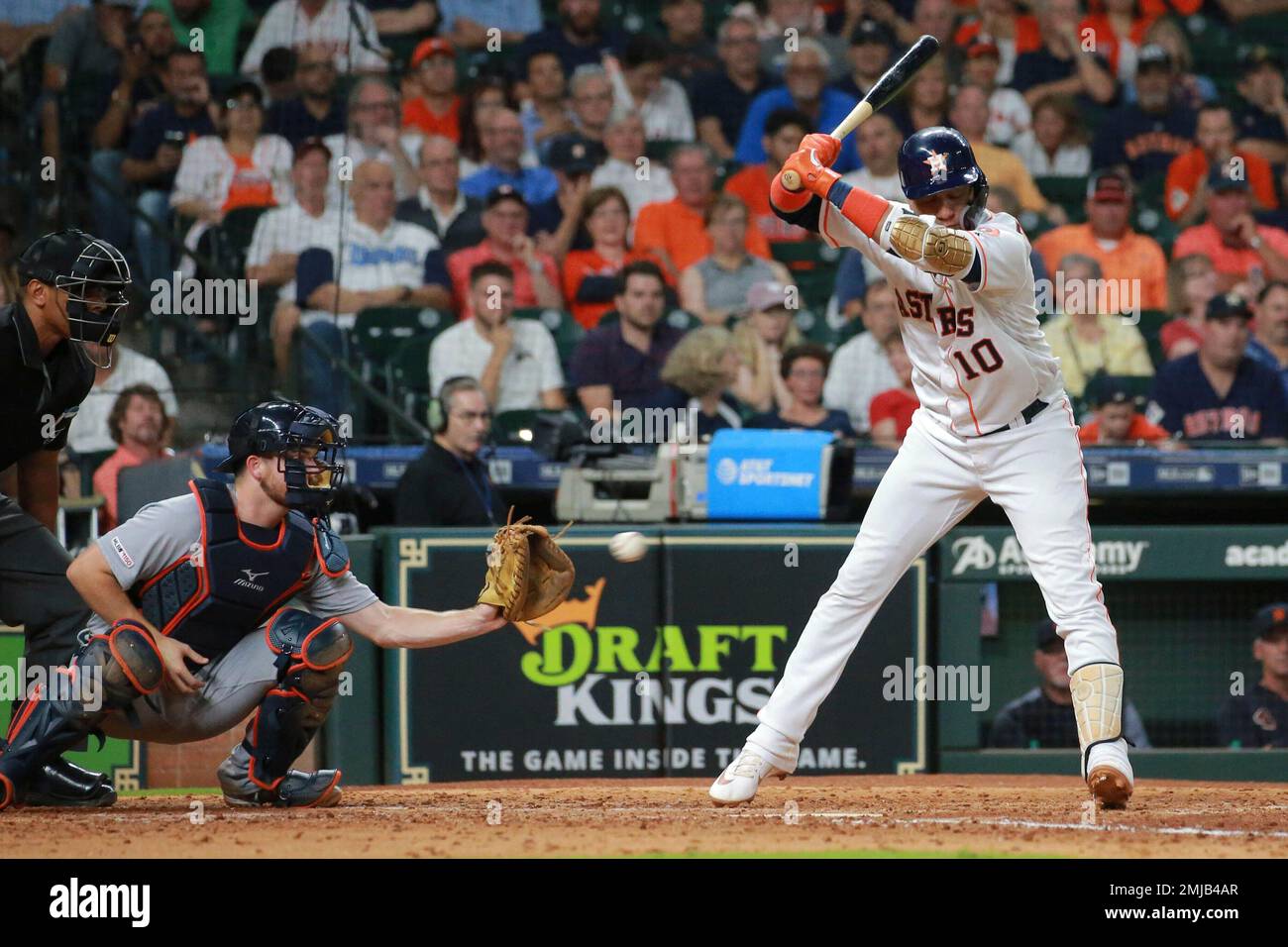 Houston Astros' Yuli Gurriel, right, dodges an inside pitch from ...