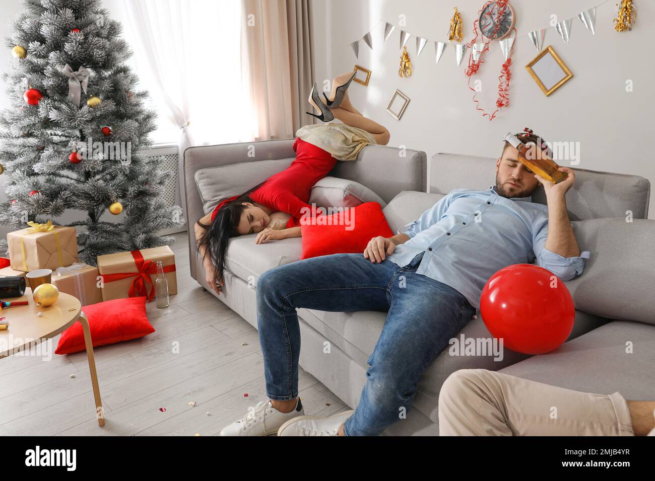 Drunk friends sleeping in messy room after New Year party Stock Photo ...